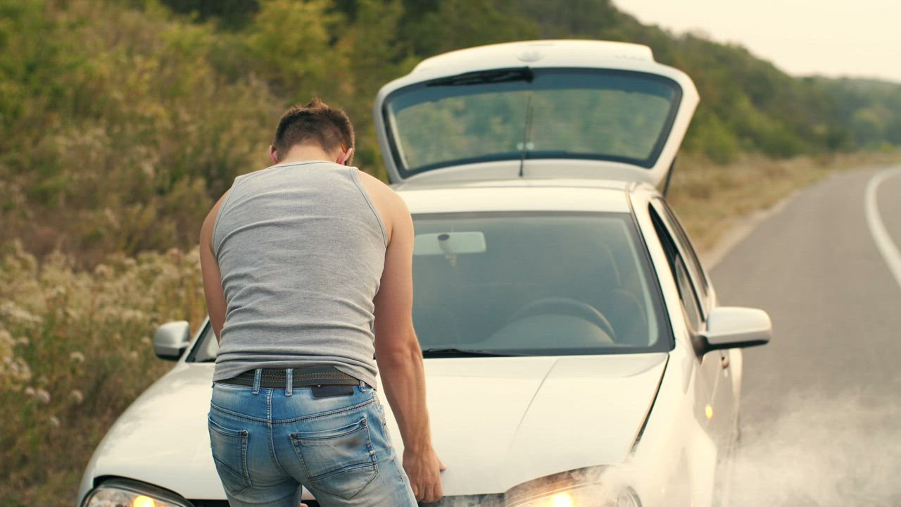 Stranded on the road with a smoking broken car - Free Stock Video