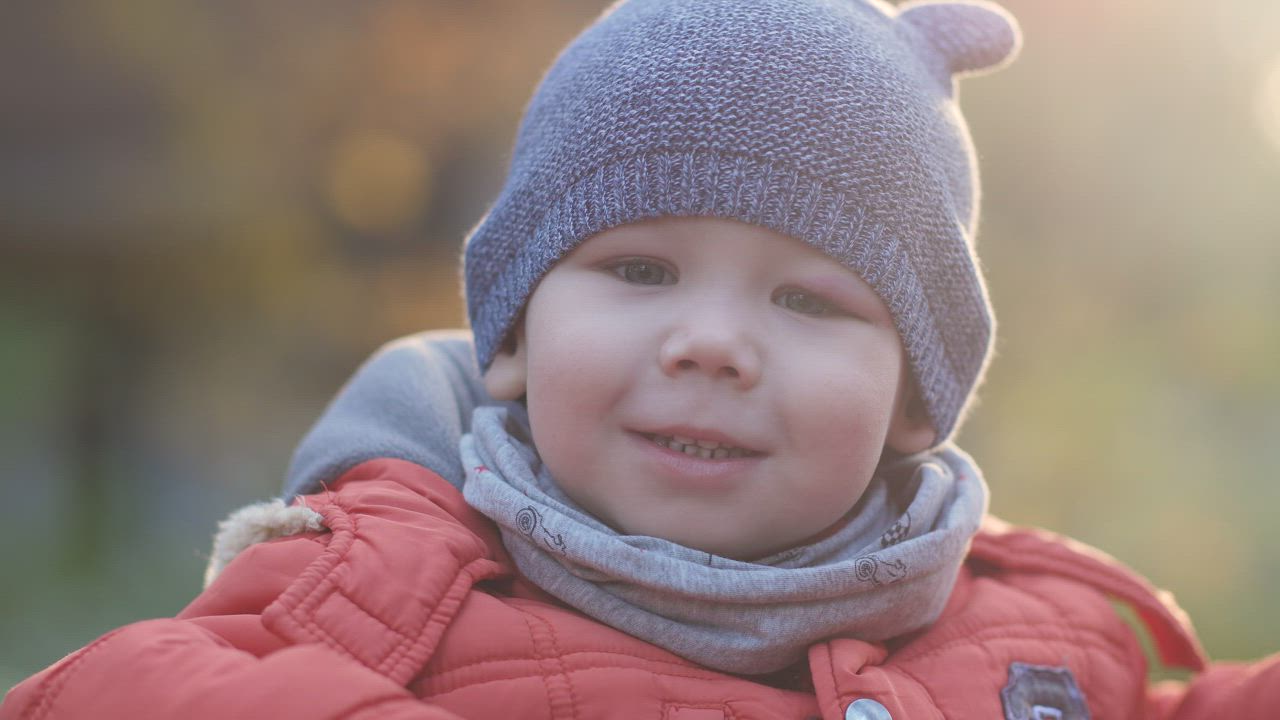 Boy smiling at the camera on a cold day - Free Stock Video