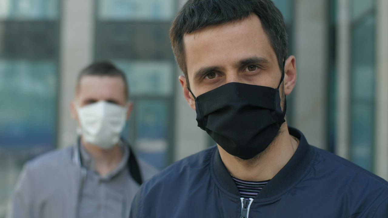 Men with face masks on the street, portrait - Free Stock Video