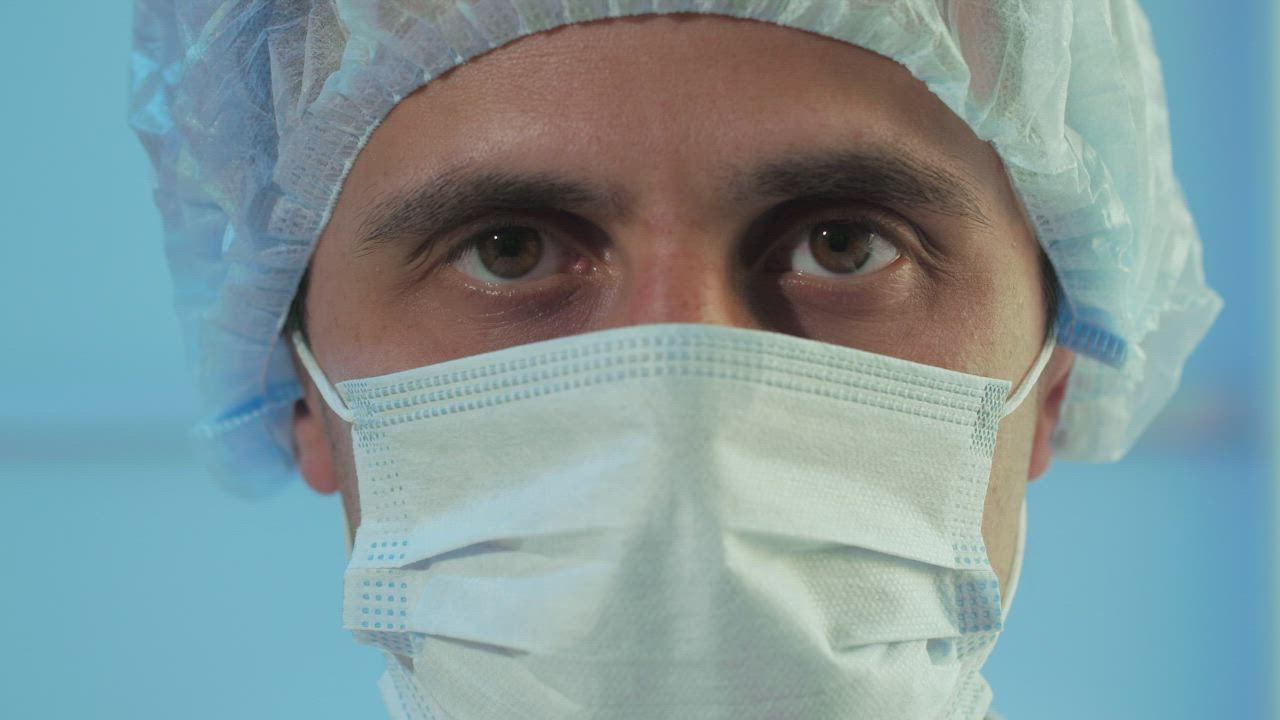 Portrait of a doctor with a mask - Free Stock Video