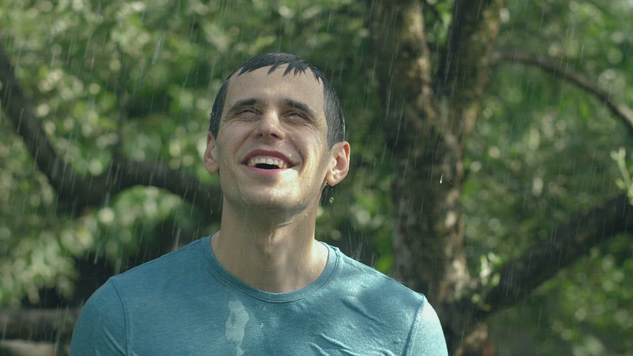Man enjoying the rain in nature - Free Stock Video