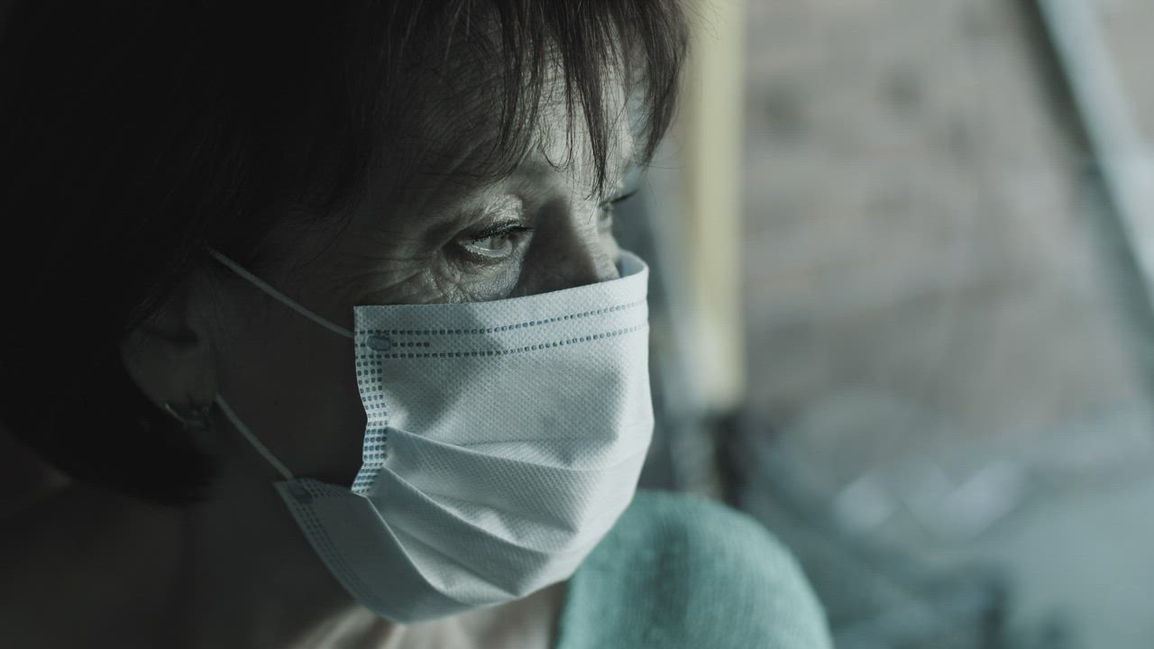 Old woman with sad look wearing mask - Free Stock Video