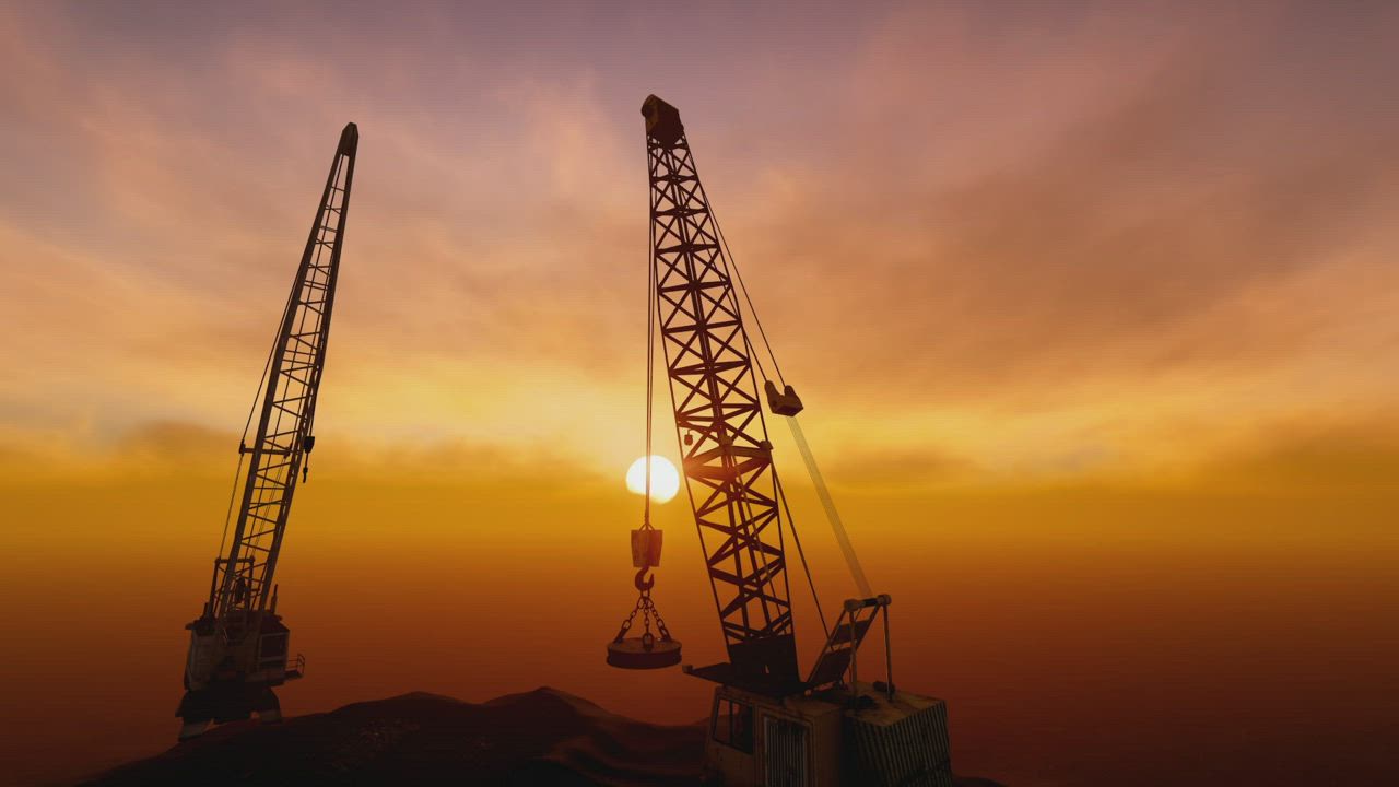 Construction cranes in front of the sunset - Free Stock Video