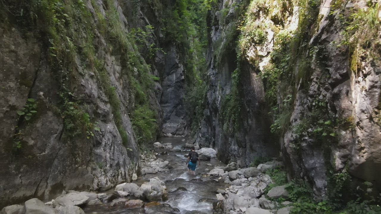 Rocky River in between two mountains precipitous - Free Stock Video