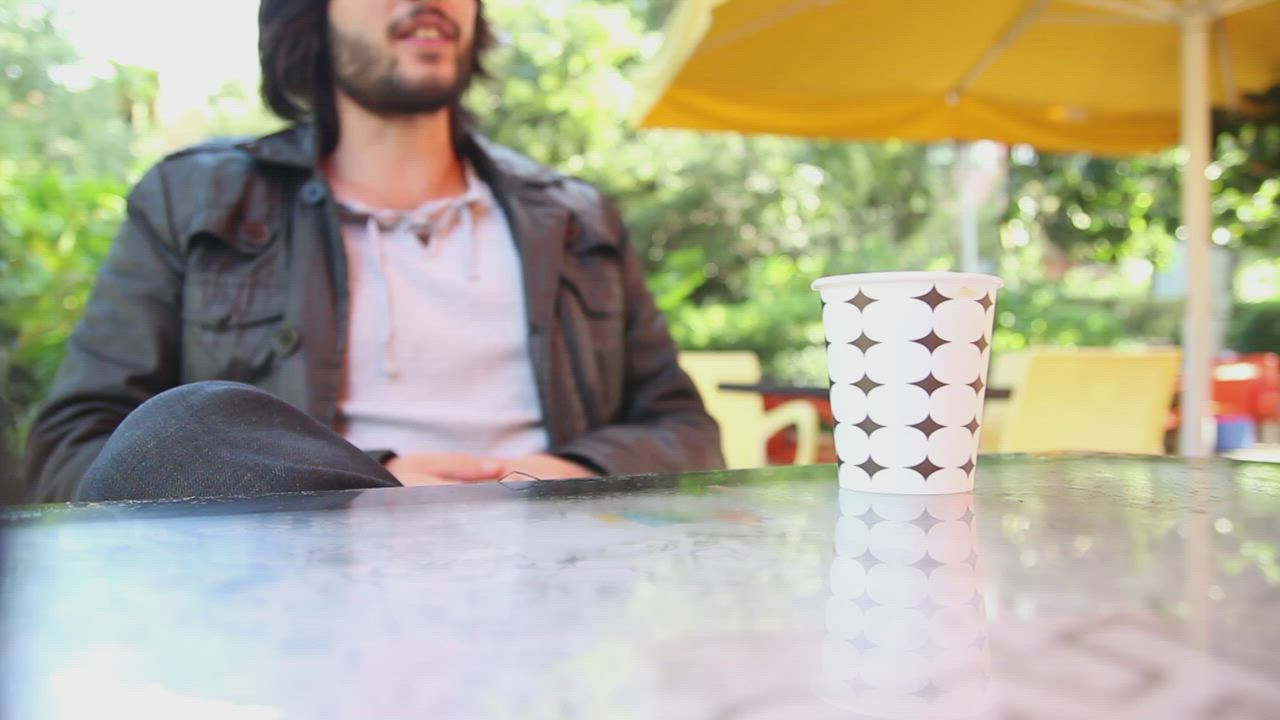 Man talking drinking coffee outside - Free Stock Video