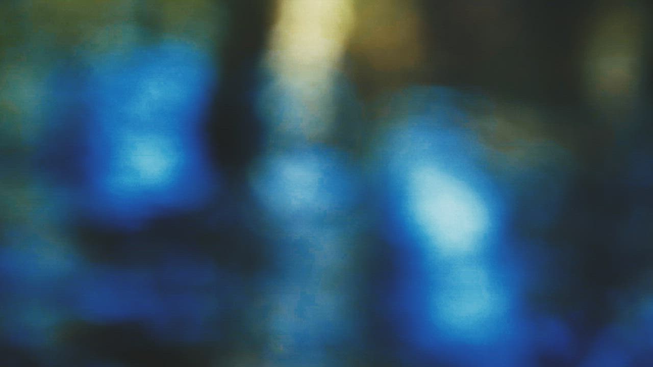 Defocused blue lights reflected in water - Free Stock Video