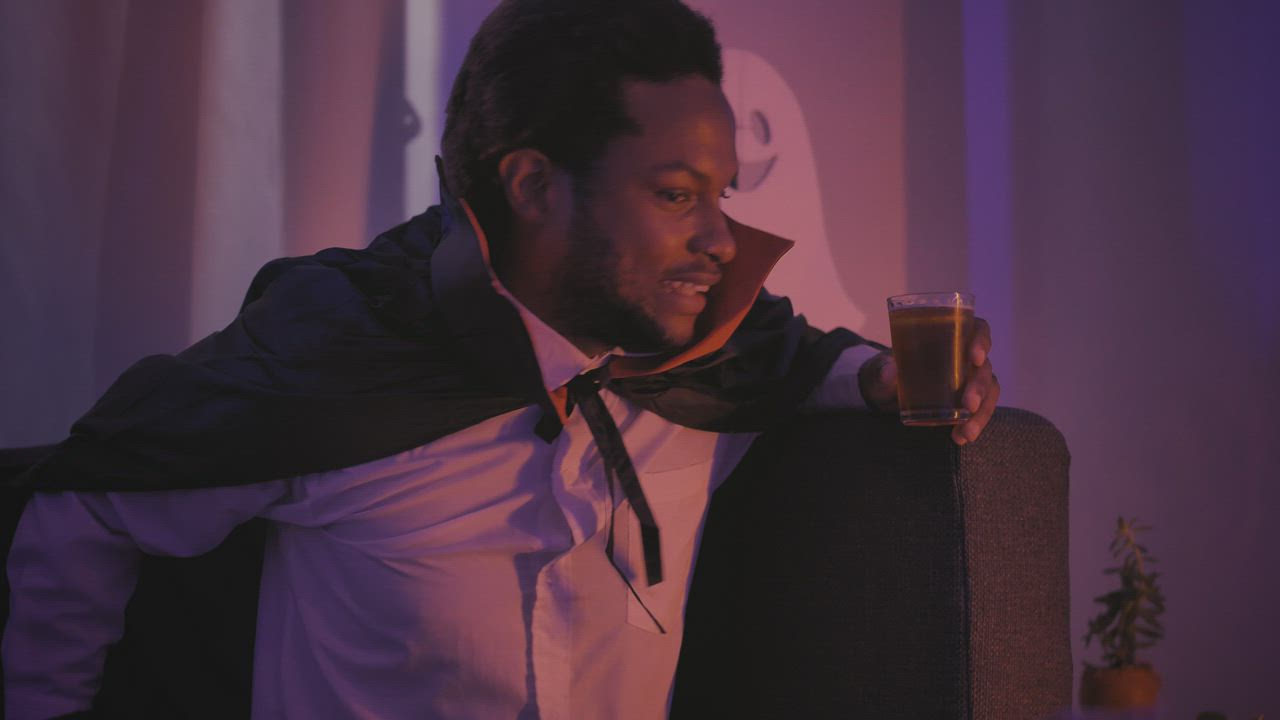 Boy dressed as a vampire at a Halloween costume party - Free Stock Video