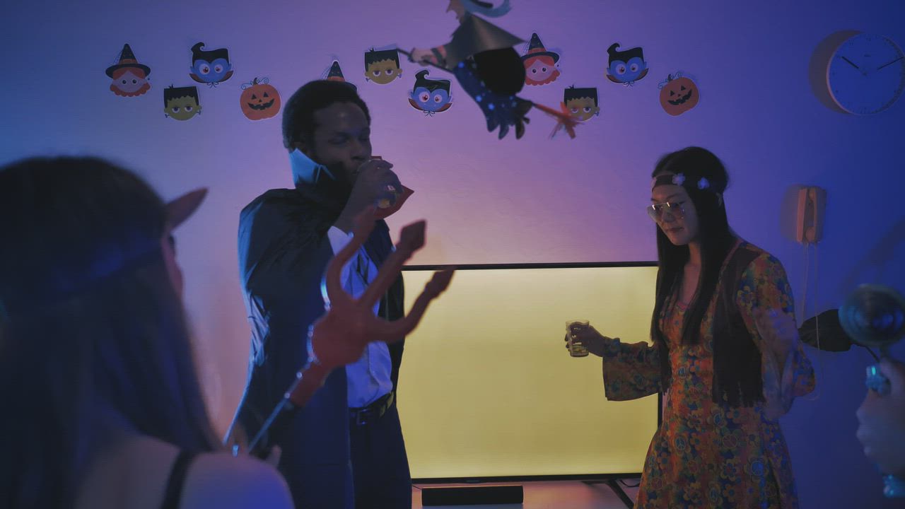 People dancing at a little costume party - Free Stock Video