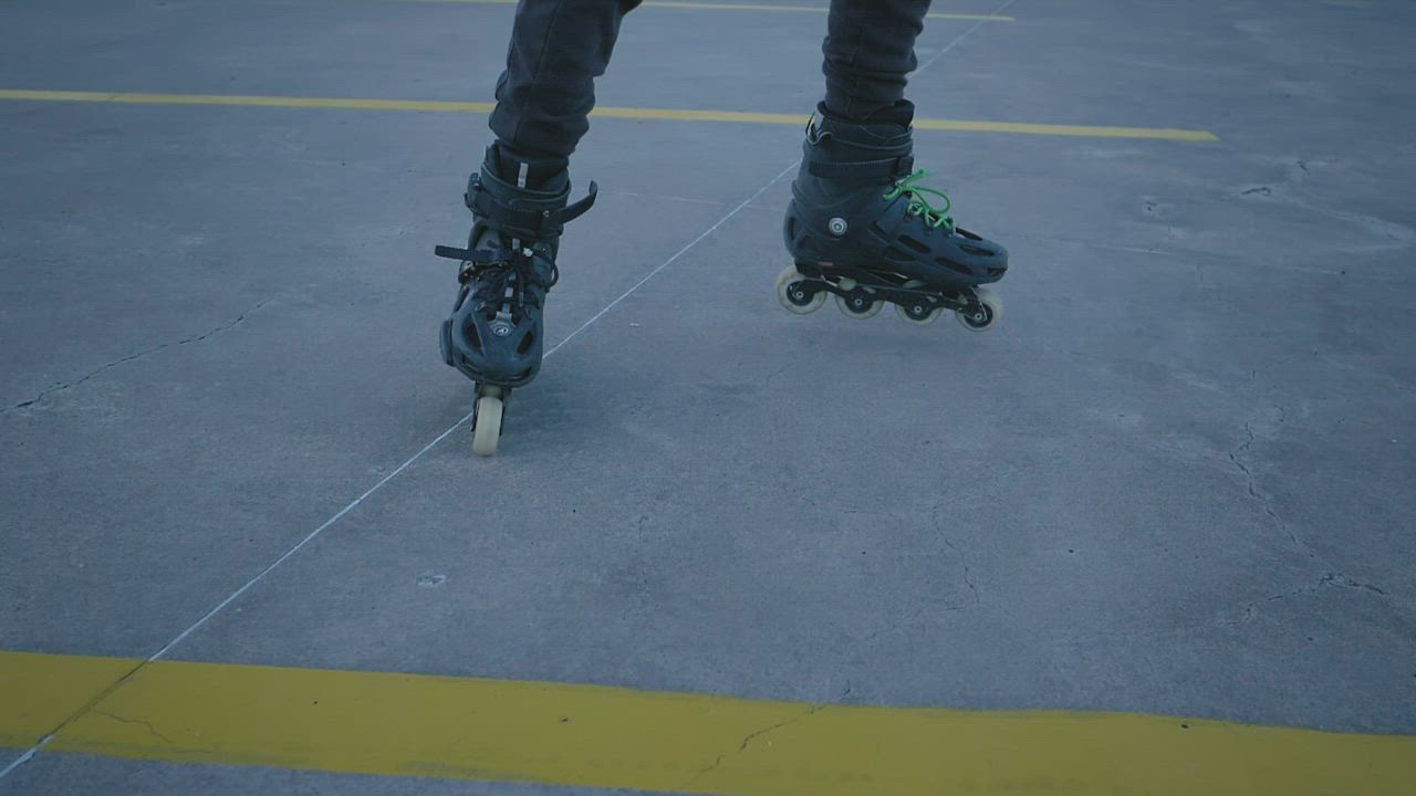 Rolling skates through a parking lot - Free Stock Video