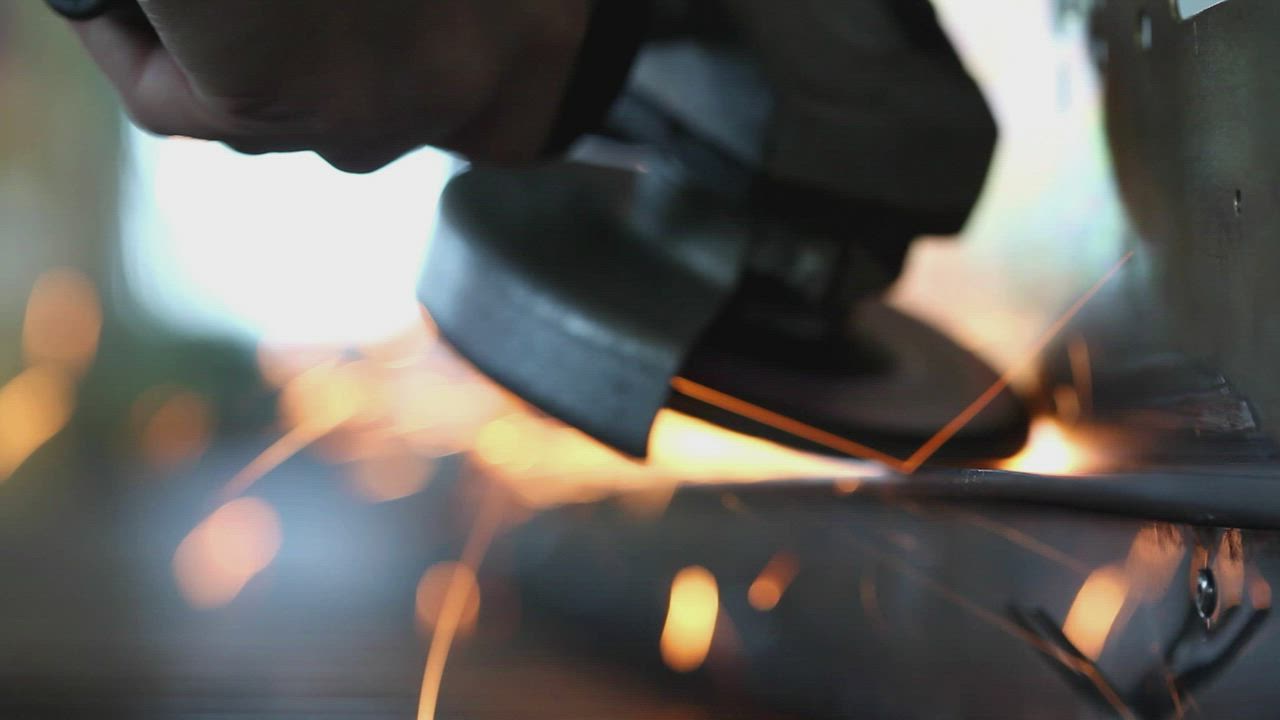 Sparks from a grinder, close up - Free Stock Video