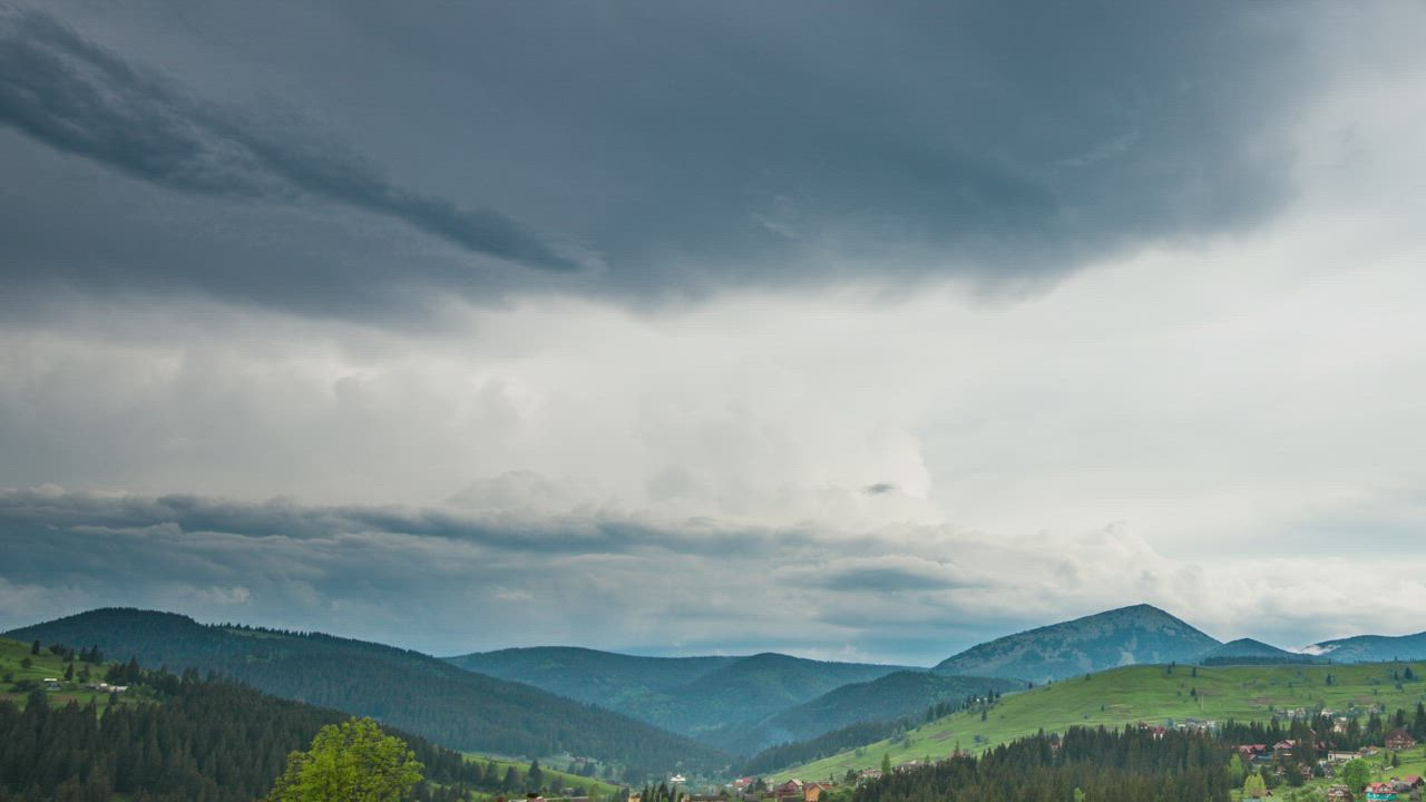 Cloudy landscape in a village - Free Stock Video
