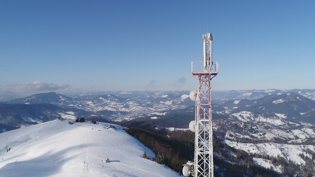 Aerial shot of an ice covered communications tower - Free Stock Video