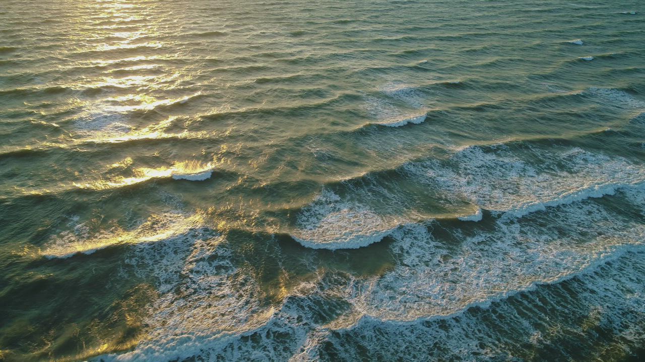 Small waves reaching the beach - Free Stock Video
