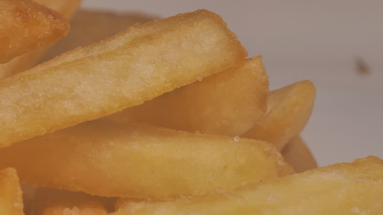 Texture of french fries with ketchup, macro close up - Free Stock Video