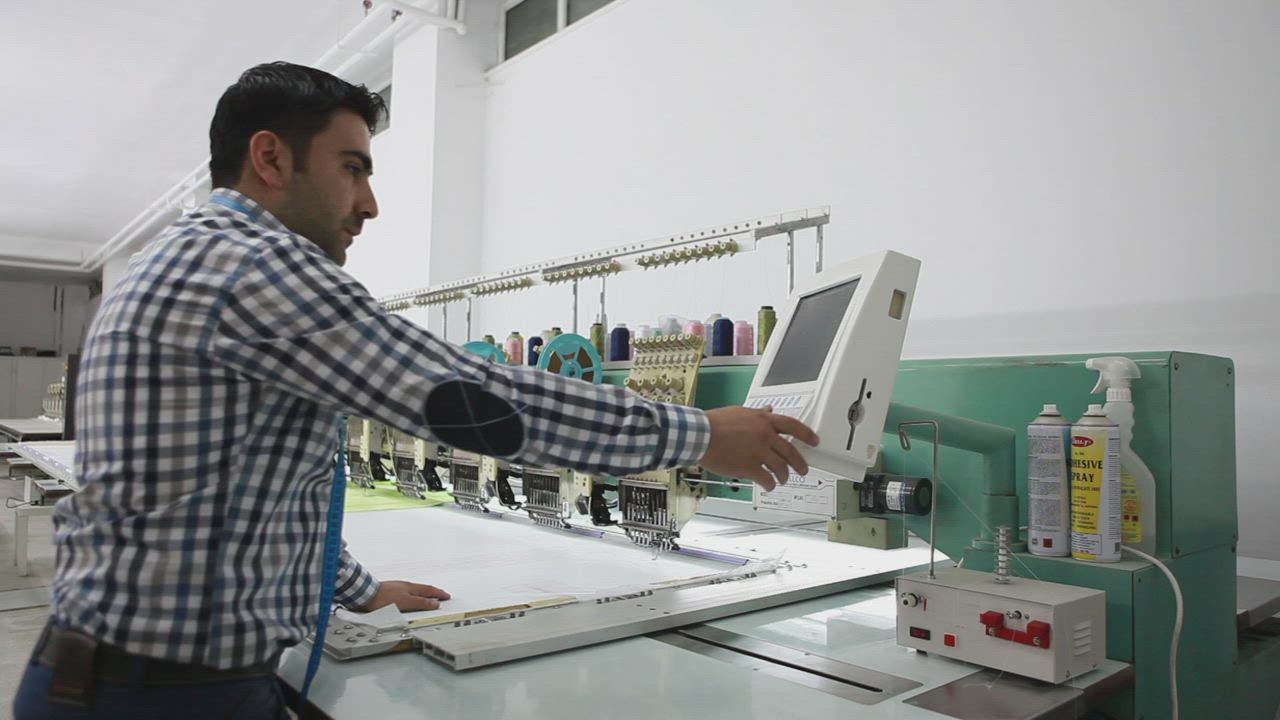 Man programming a large industrial machine - Free Stock Video