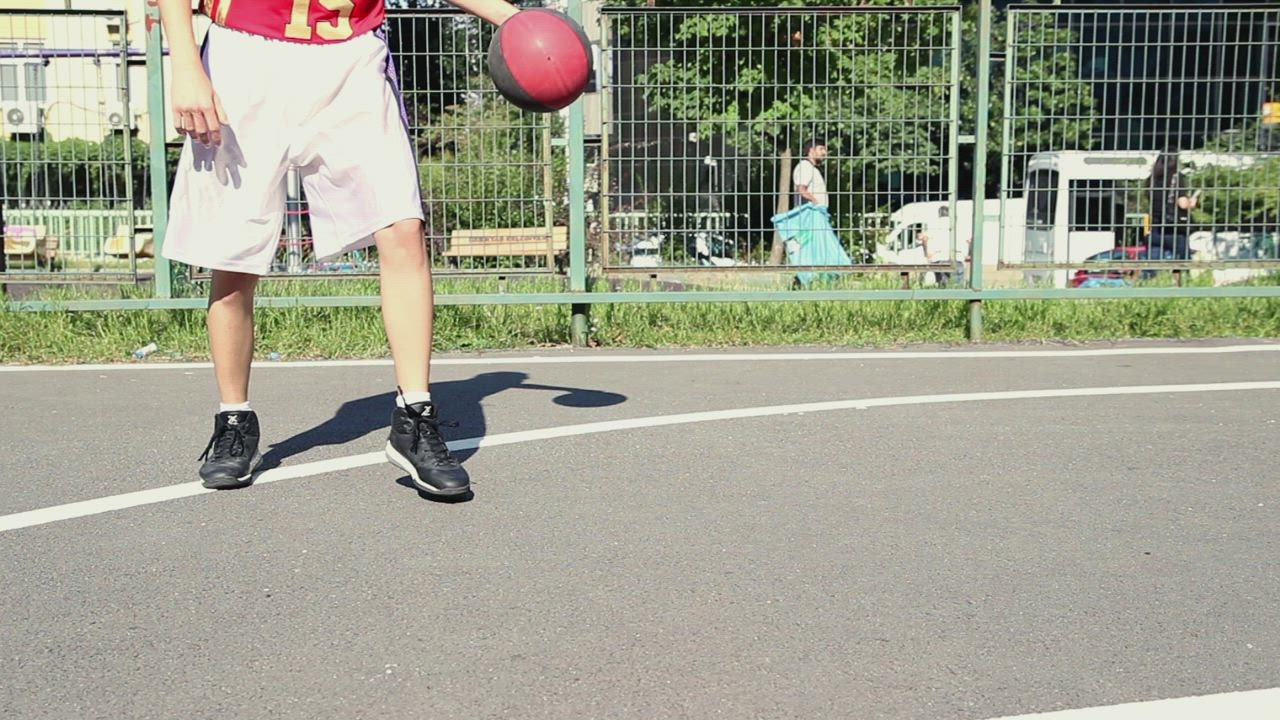 Skillful basketball player dribbling the ball - Free Stock Video