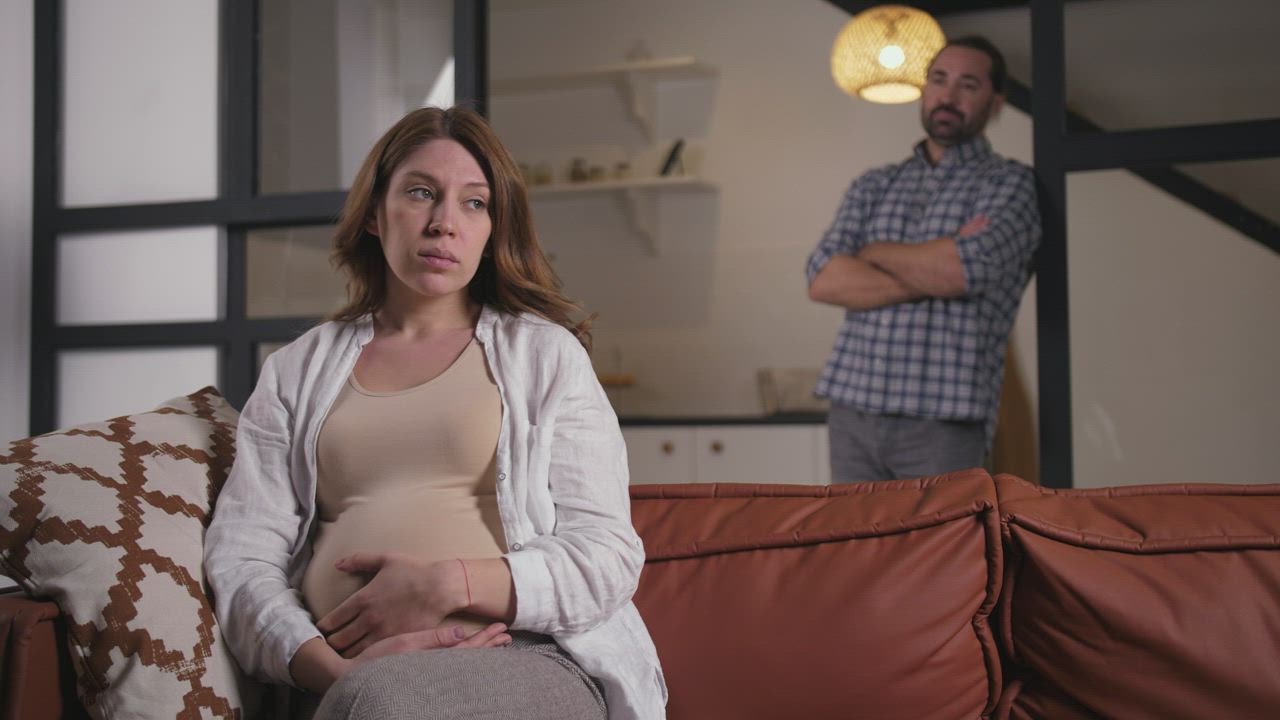 Worried pregnant woman and her husband at home - Free Stock Video