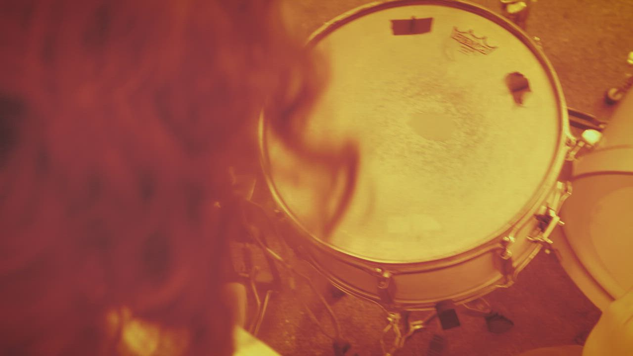 Playing the drums on a sepia filter - Free Stock Video