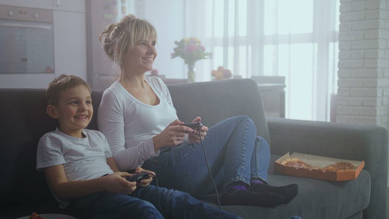 Mother and son playing video games together - Free Stock Video