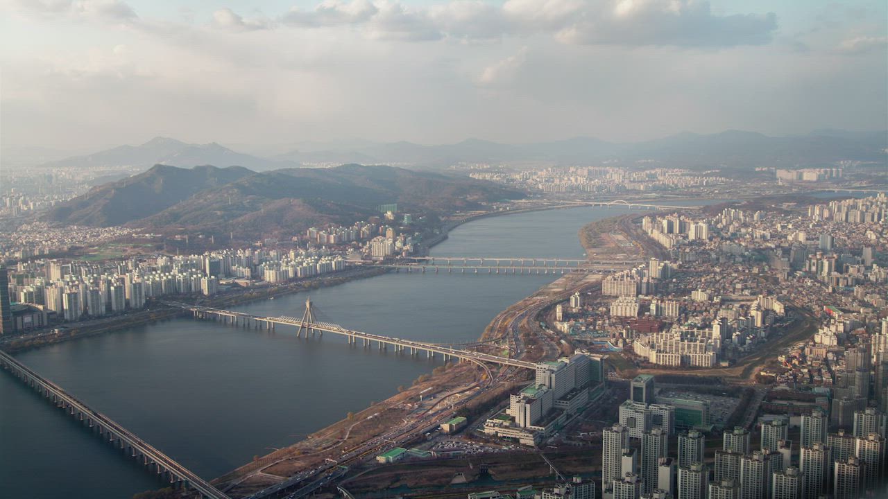 River with bridges surrounded by a big city - Free Stock Video