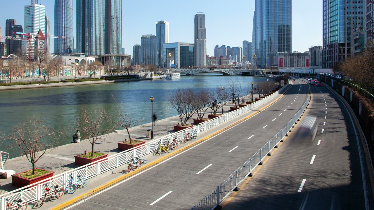 River that divides a city from large skyscrapers - Free Stock Video