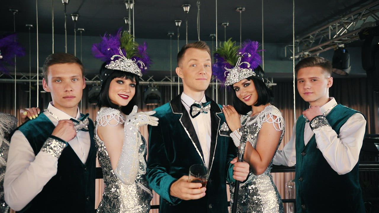Male and female dancers in full dress at a bar - Free Stock Video