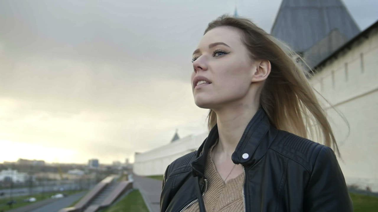 Wind slowly moving the hair of a young woman - Free Stock Video