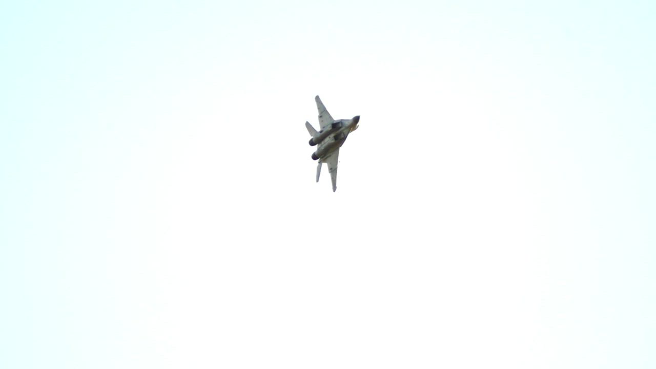 Jet spinning while flying in the sky - Free Stock Video