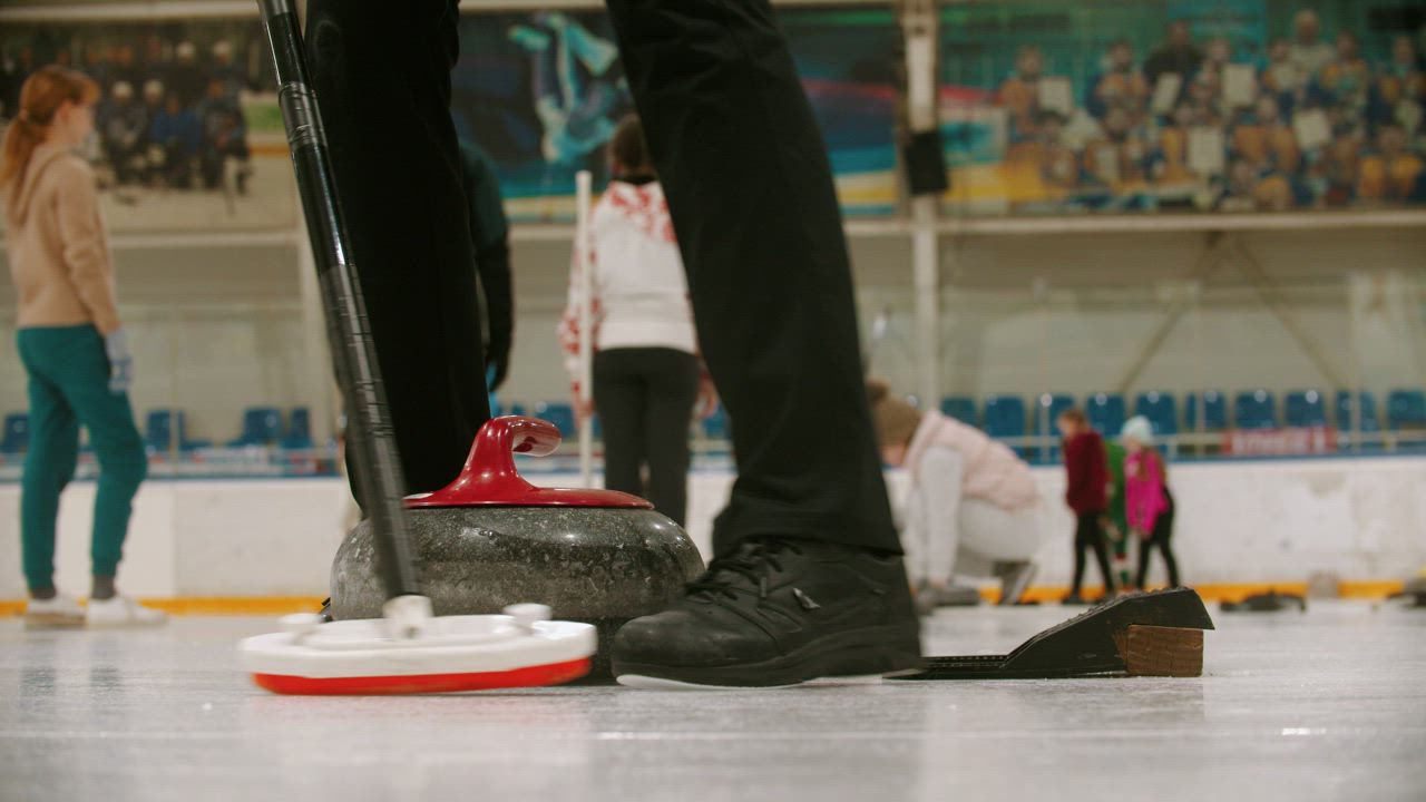 Close up shot of a person playing curling - Free Stock Video