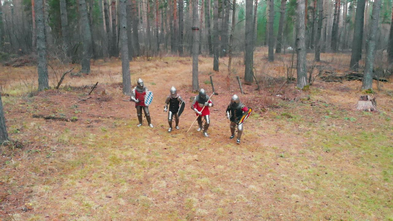 Medieval warriors running in a forest - Free Stock Video