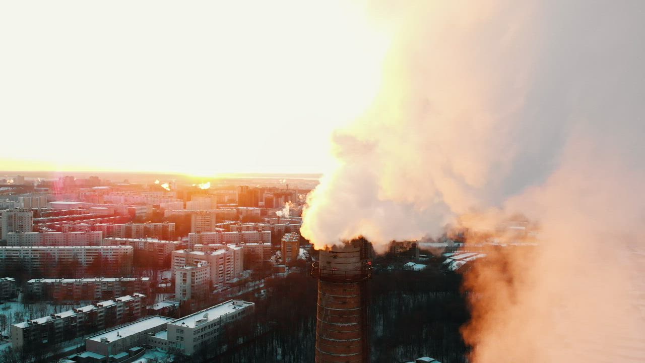 Factory polluting in a city - Free Stock Video