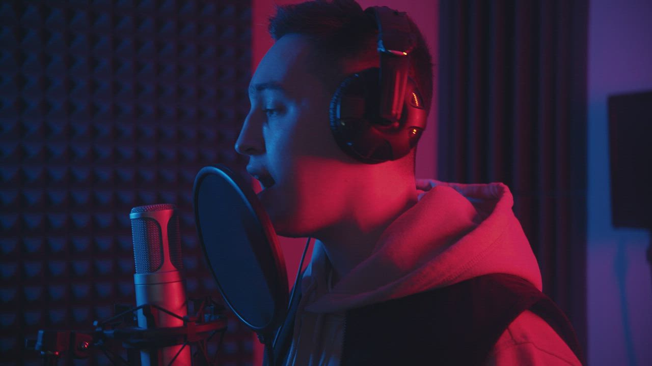 Rap singer records a song in a studio - Free Stock Video