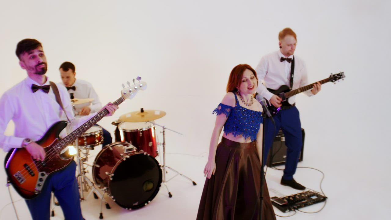 Musical band playing a song on a photo studio - Free Stock Video