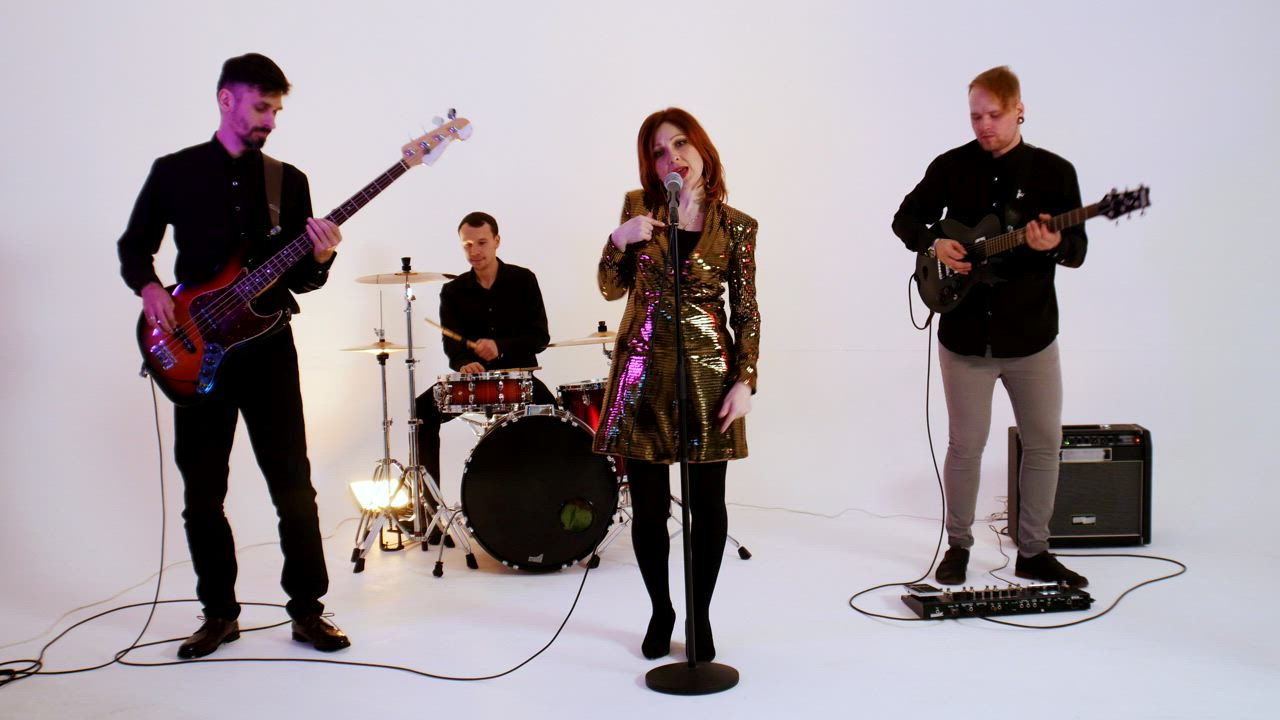 Pop band performing at a photo studio - Free Stock Video