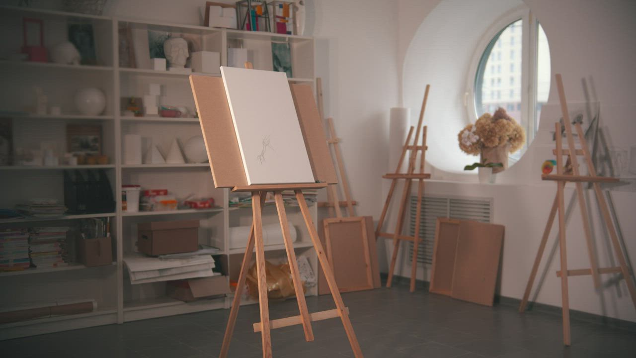 Young artist drawing on canvas at her workshop - Free Stock Video