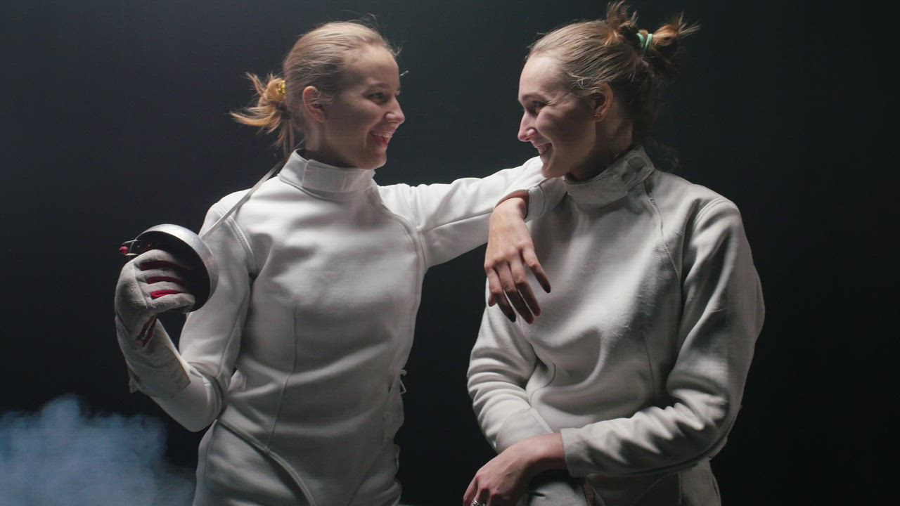 Two fencer friends talking after a duel - Free Stock Video