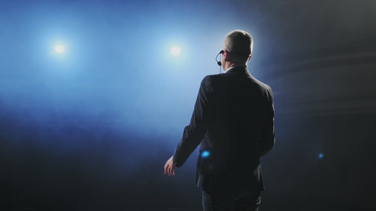 Back view of a presented on stage - Free Stock Video