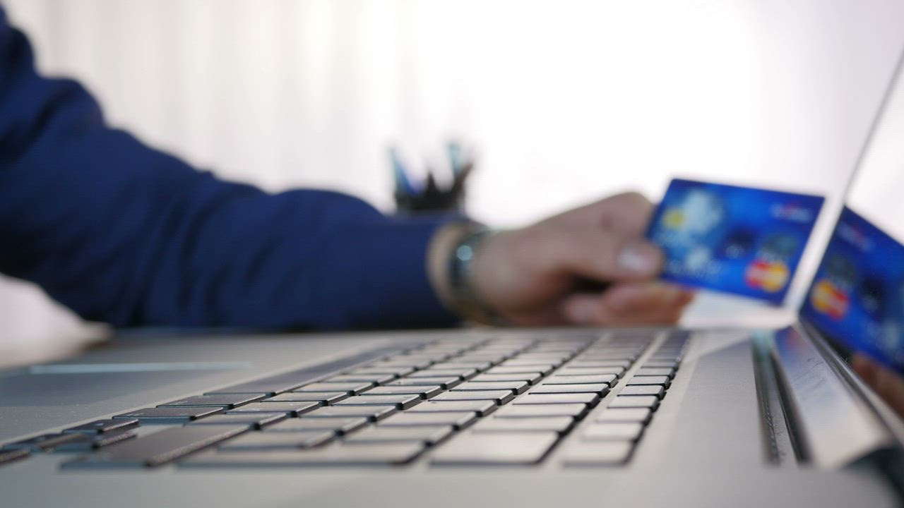 Entering bank details on a computer - Free Stock Video