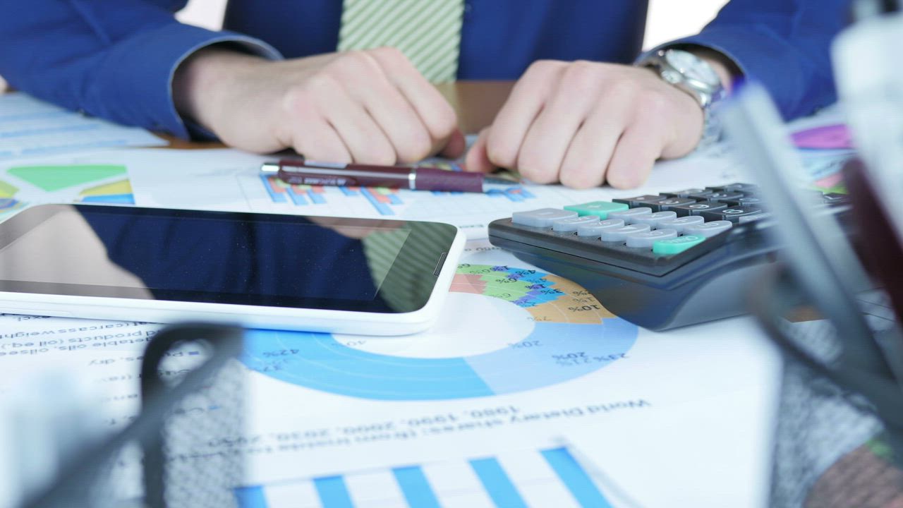 Man reviewing and rectifying graphs - Free Stock Video