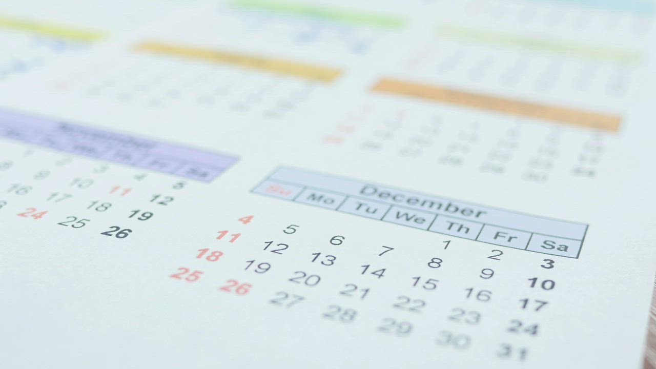 Crossing out days with down on a calendar - Free Stock Video