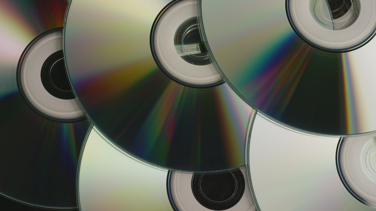 CD's texture slowly rotating - Free Stock Video