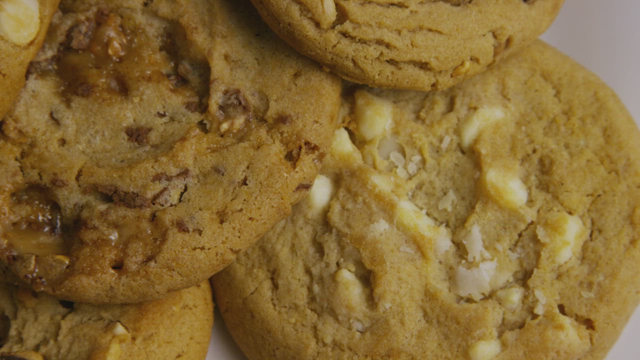 Walnut cookies rotating on a white plate - Free Stock Video