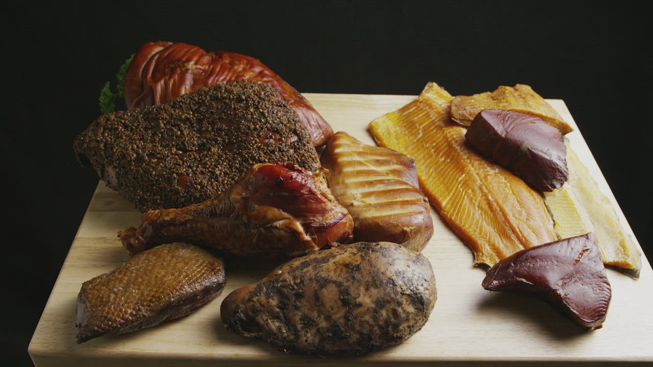 Slowly rotating meat of various kinds - Free Stock Video