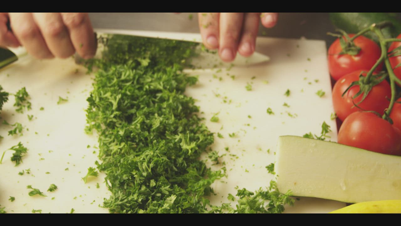 Hands of a cook chopping vegetables - Free Stock Video
