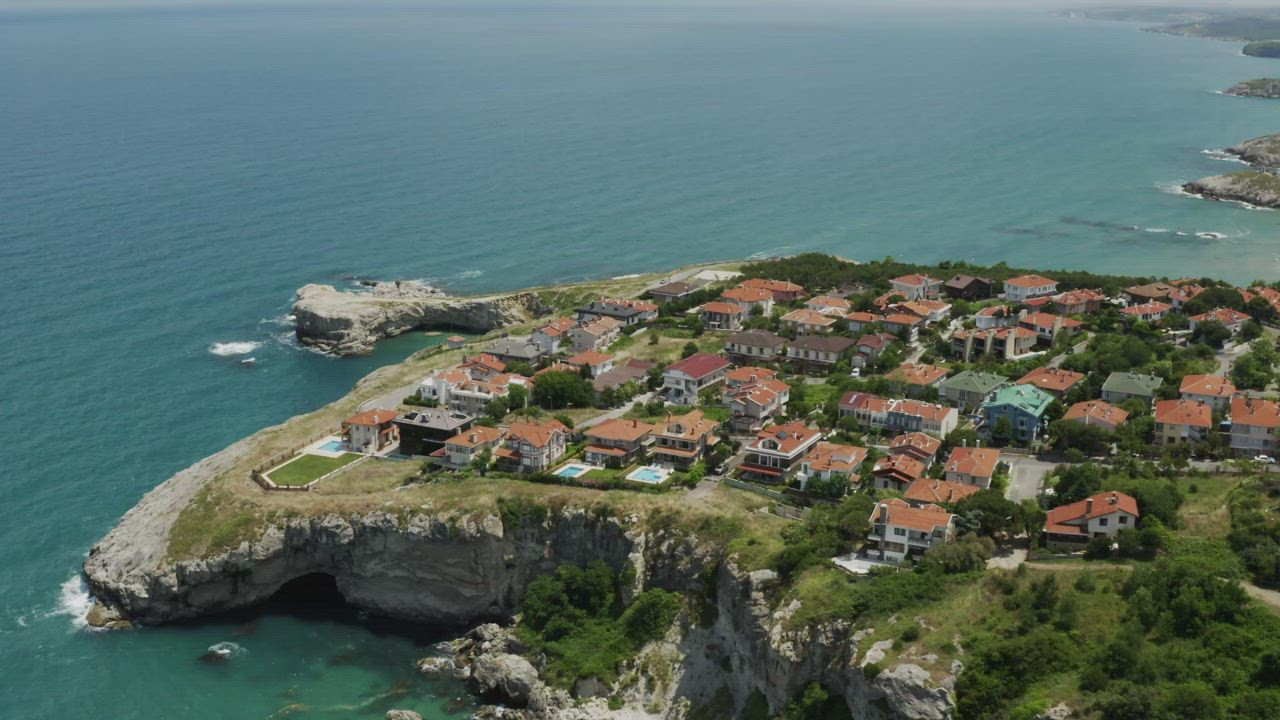 Aerial landscape of a coastal town on a peninsula - Free Stock Video