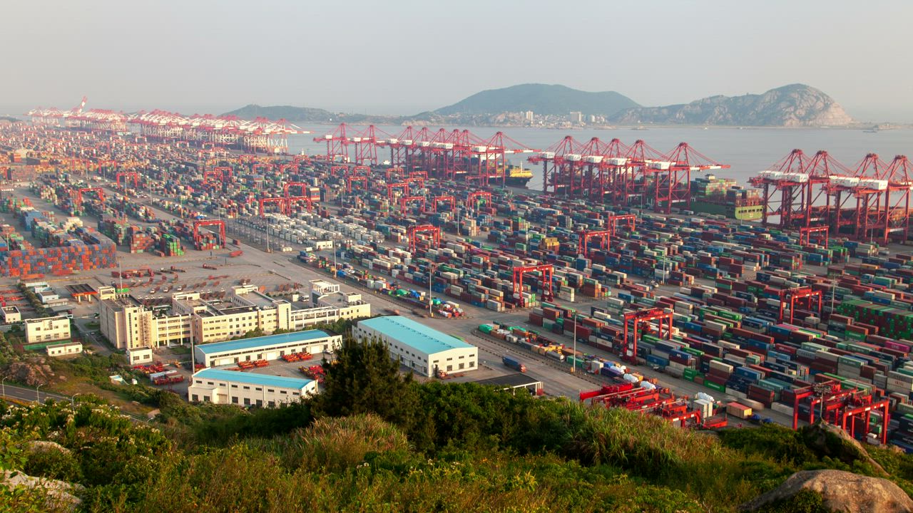 Large cargo warehouse area on a shoreline - Free Stock Video