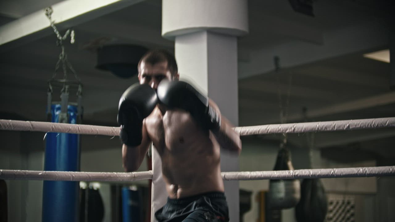 Man training box in a ring - Free Stock Video
