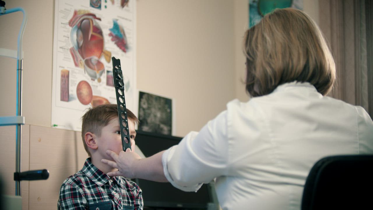 Little boy at an ophthalmologist appointment - Free Stock Video