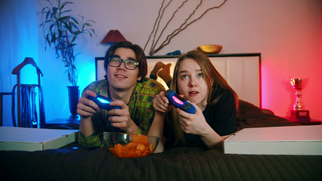 Boy and girl playing video games - Free Stock Video