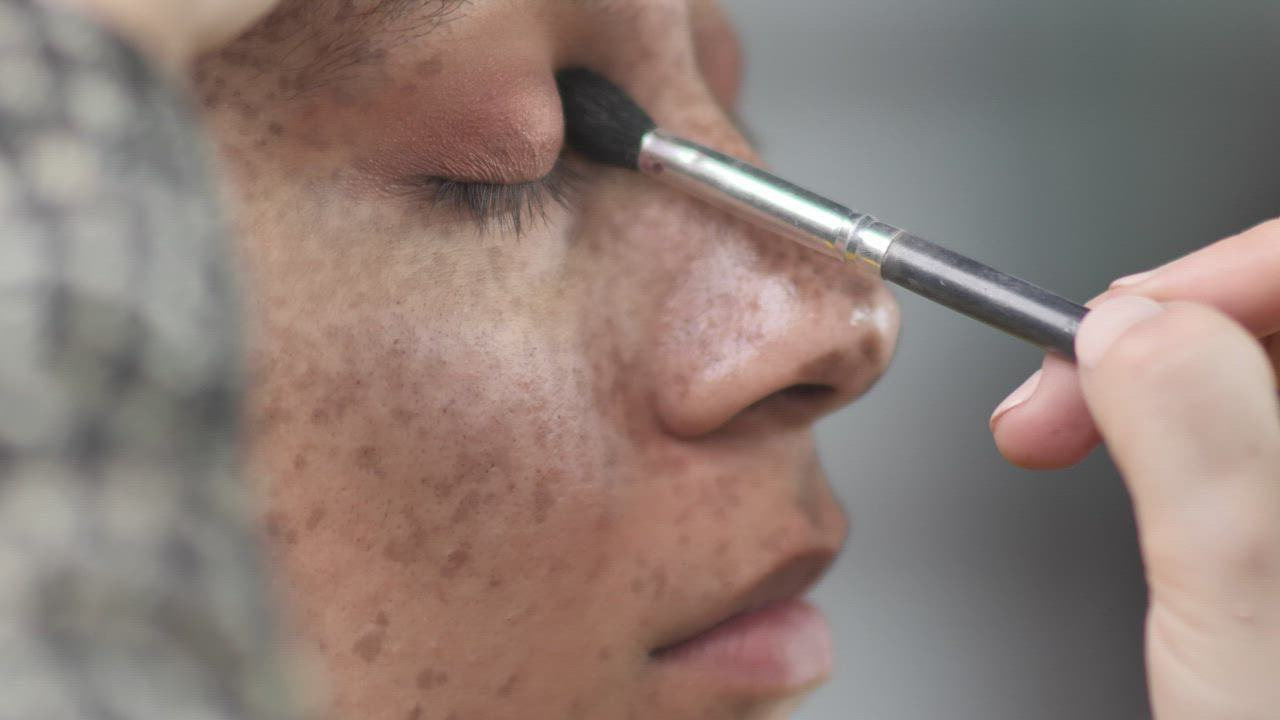 Close up of a brush gently adding makeup to a womans eyelid - Free ...